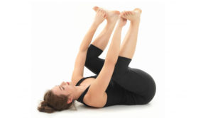 Happy Baby Pose benefits - Ananda Balasana - World Peace Yoga School